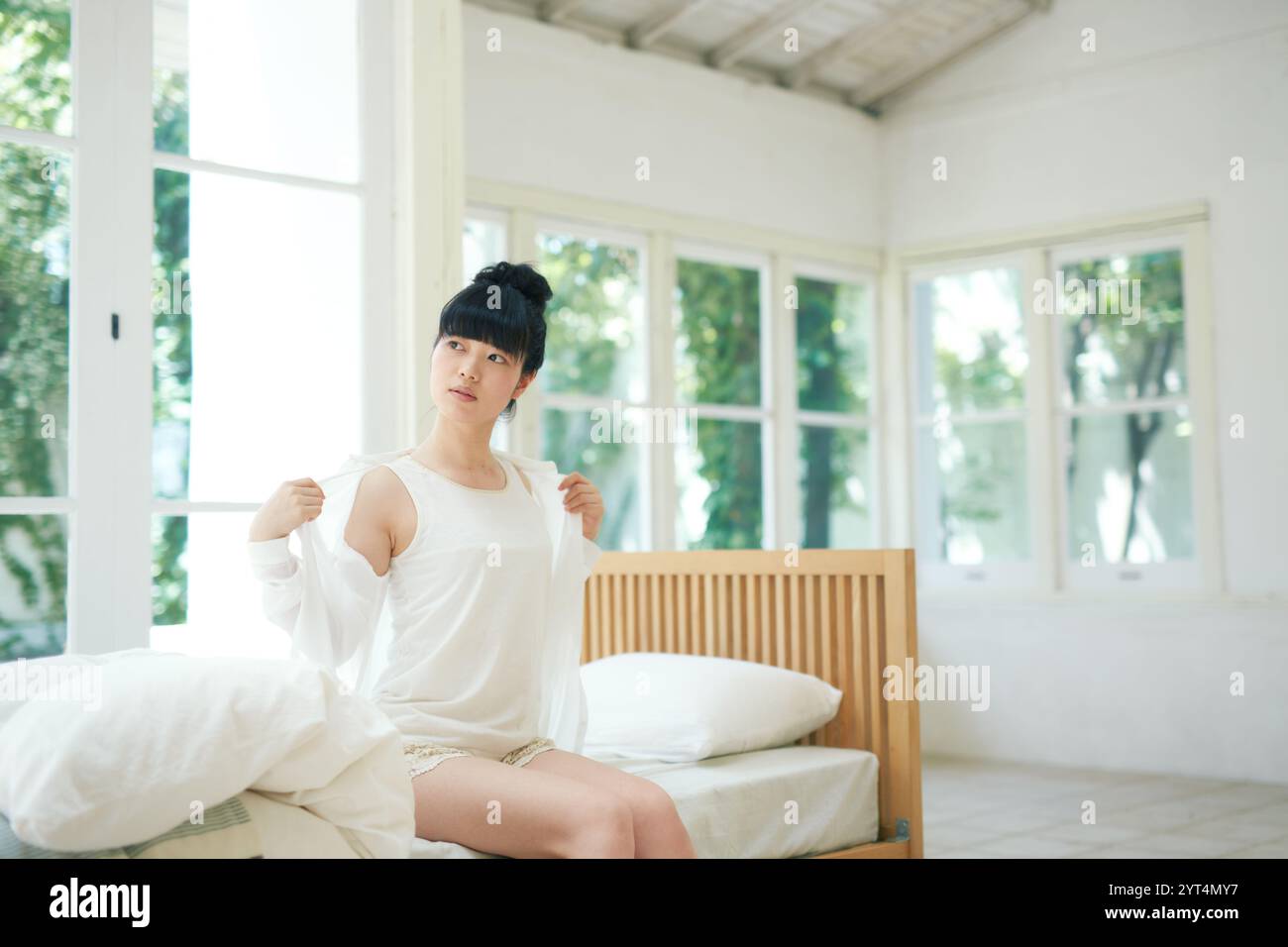 Woman changing clean bed hi-res stock photography and images - Alamy