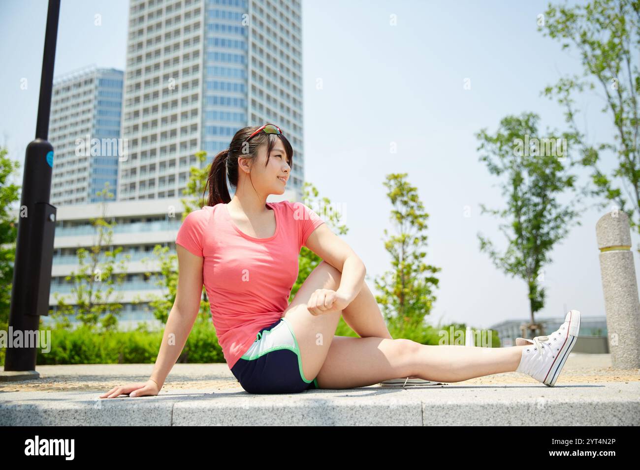 Young woman doing preparatory exercise before exercise Stock Photo - Alamy