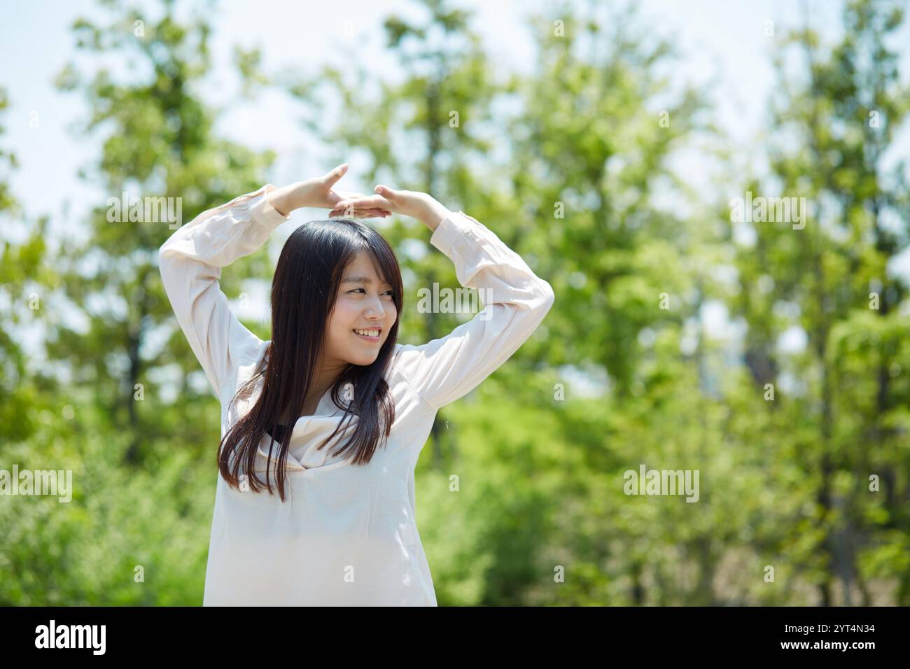 Fresh green and young woman Stock Photo - Alamy