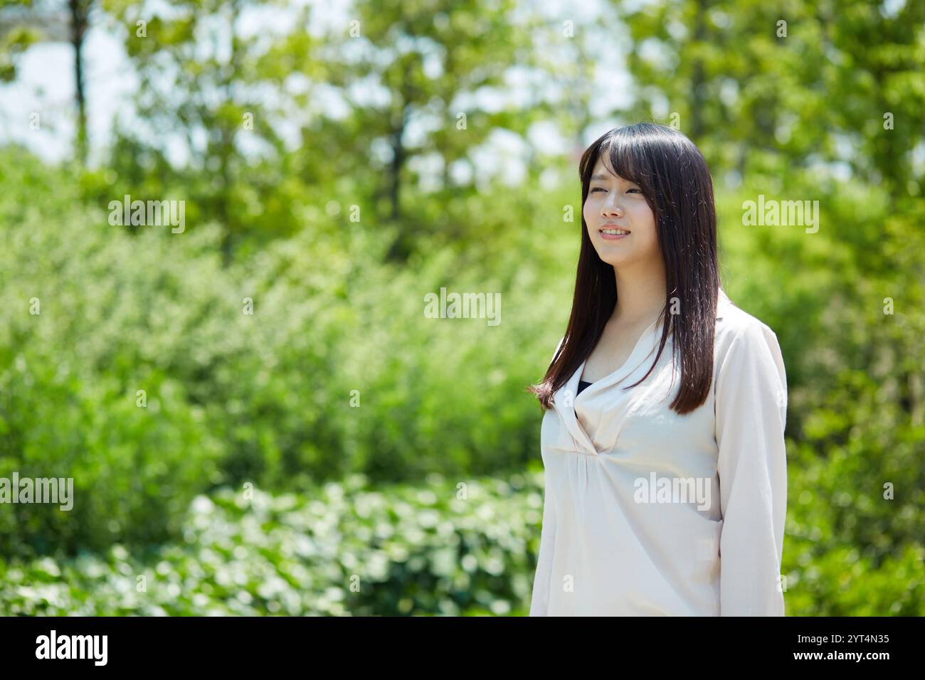 Fresh green and young woman Stock Photo - Alamy