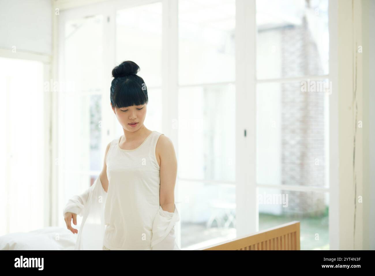 Woman changing clean bed hi-res stock photography and images - Alamy