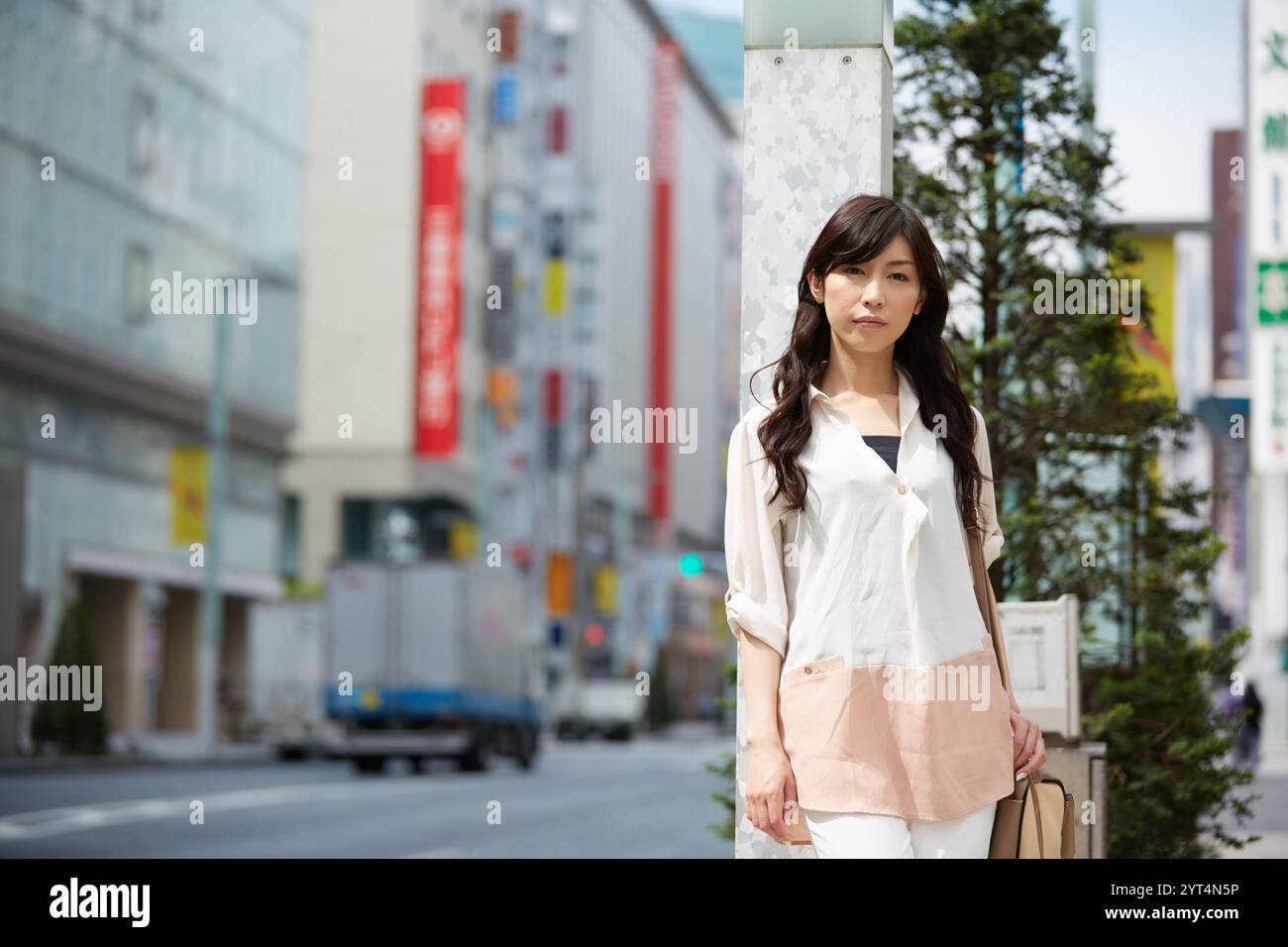 Refreshing woman in the city Stock Photo - Alamy