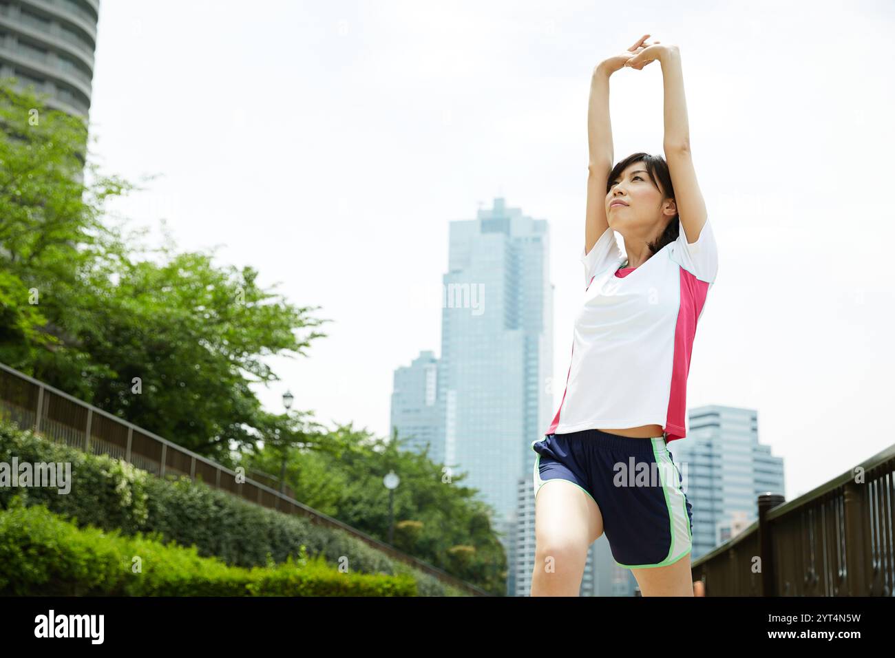 Young woman doing preparatory exercise before exercise Stock Photo - Alamy