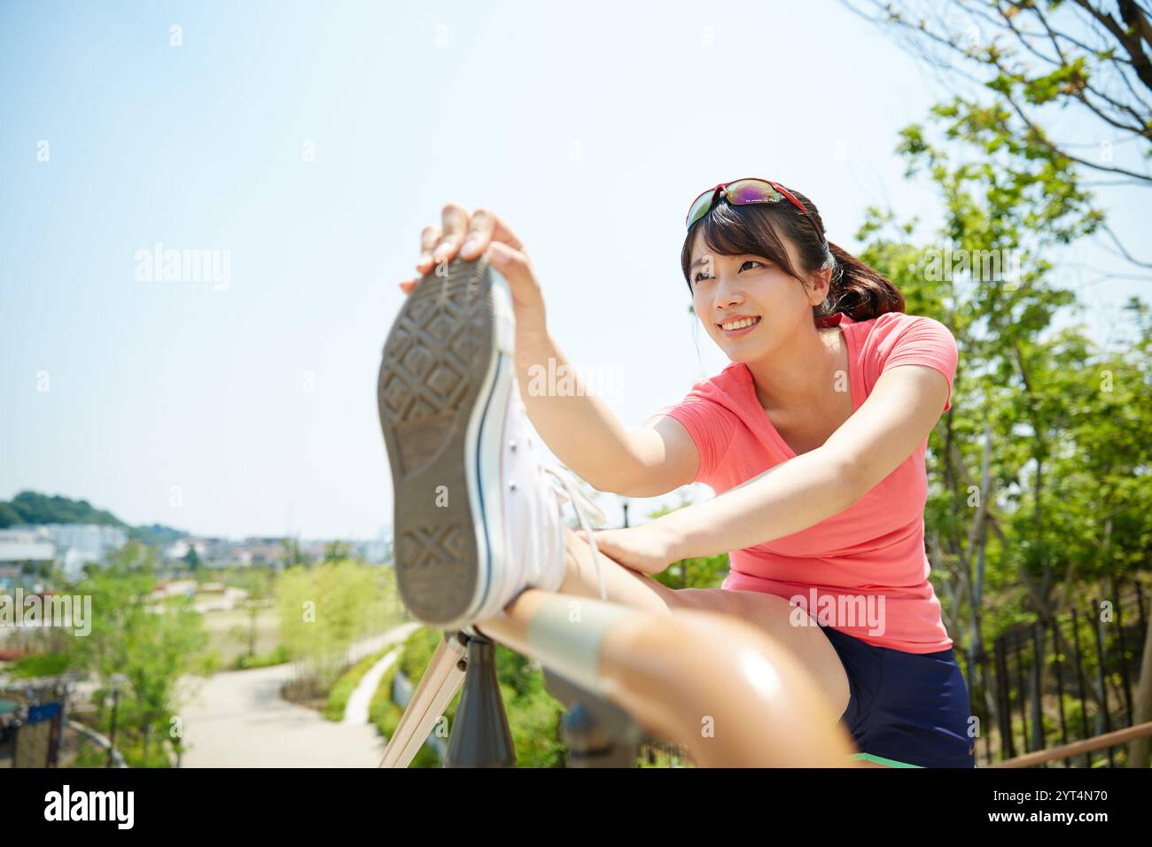 Young woman doing preparatory exercise before exercise Stock Photo - Alamy