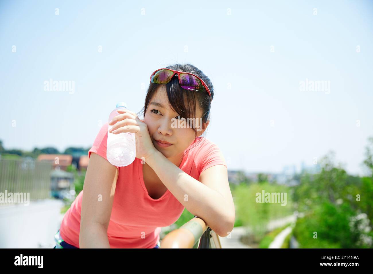 Young women hydrating during exercise Stock Photo - Alamy