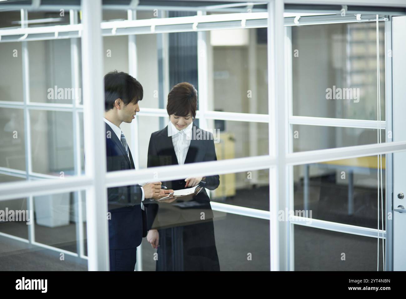 Boss and subordinate in office Stock Photo - Alamy
