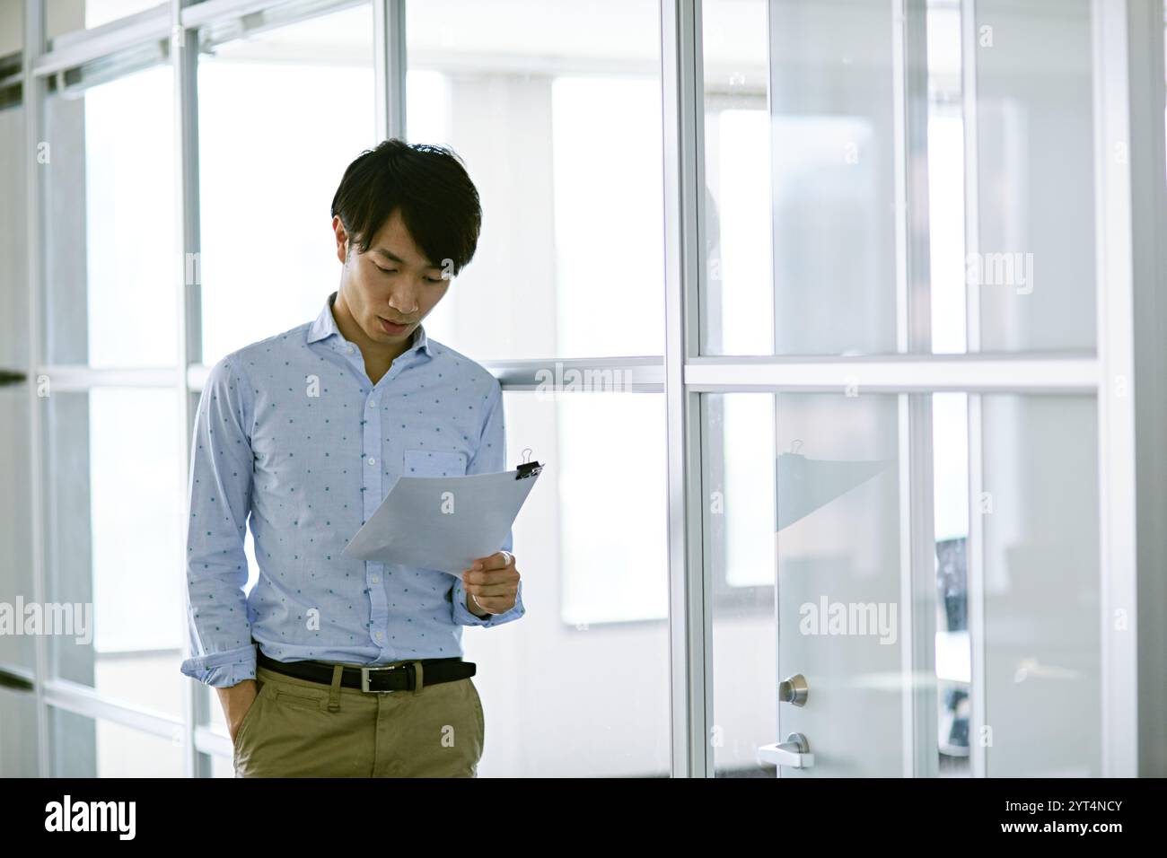 Man looking through documents hi-res stock photography and images - Alamy