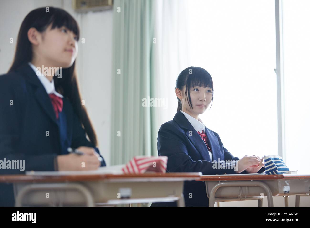 Female high school students in class Stock Photo - Alamy
