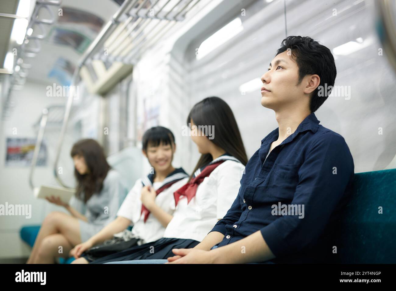 People sitting on a train Stock Photo - Alamy
