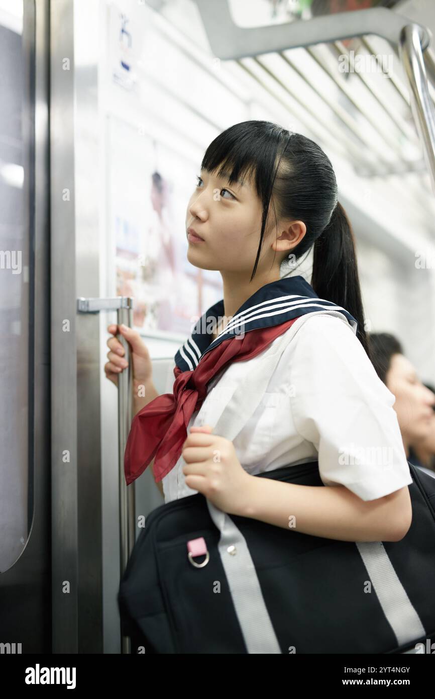 High school girls commuting by train Stock Photo - Alamy