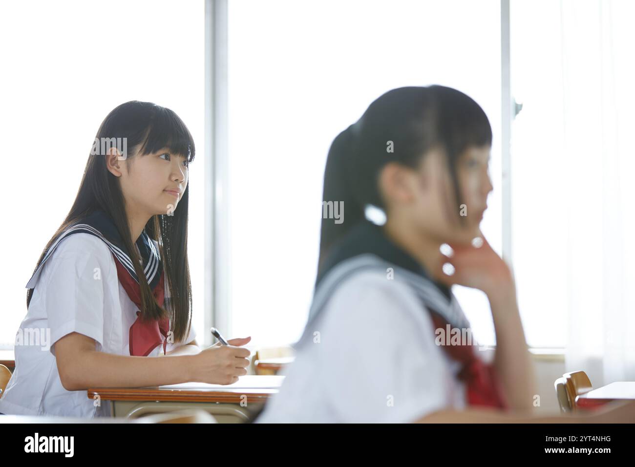 Female high school students in class Stock Photo - Alamy