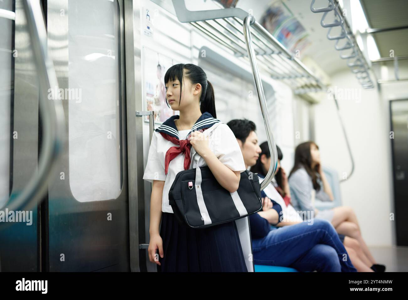 High school girls commuting by train Stock Photo - Alamy