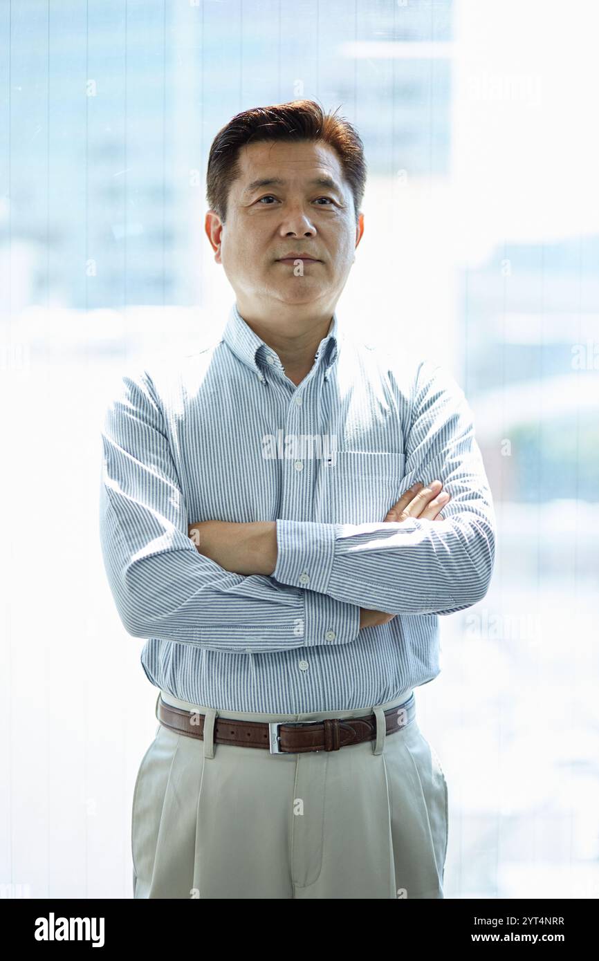 Man folding his arm hi-res stock photography and images - Alamy