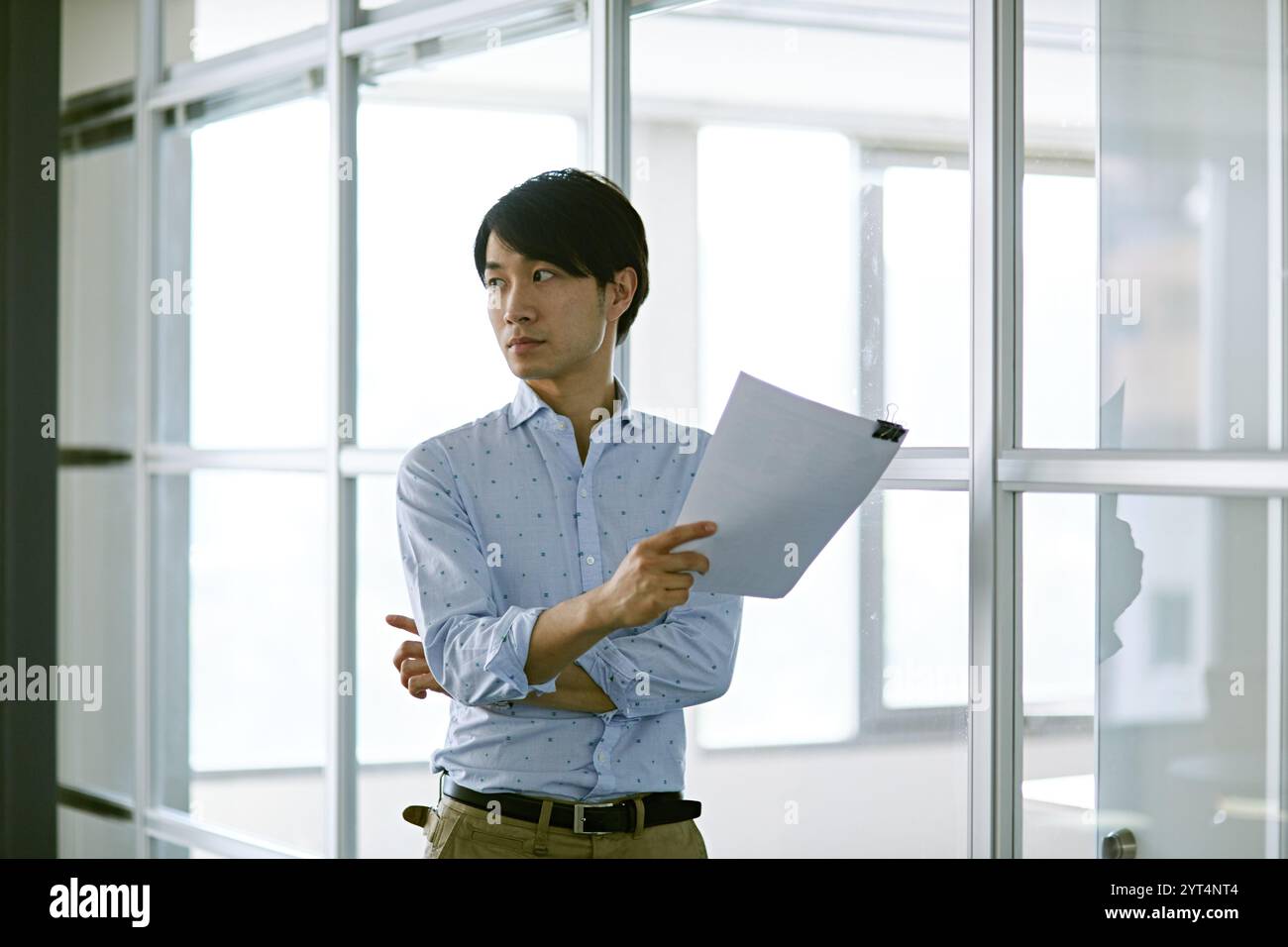 Man looking through documents hi-res stock photography and images - Alamy