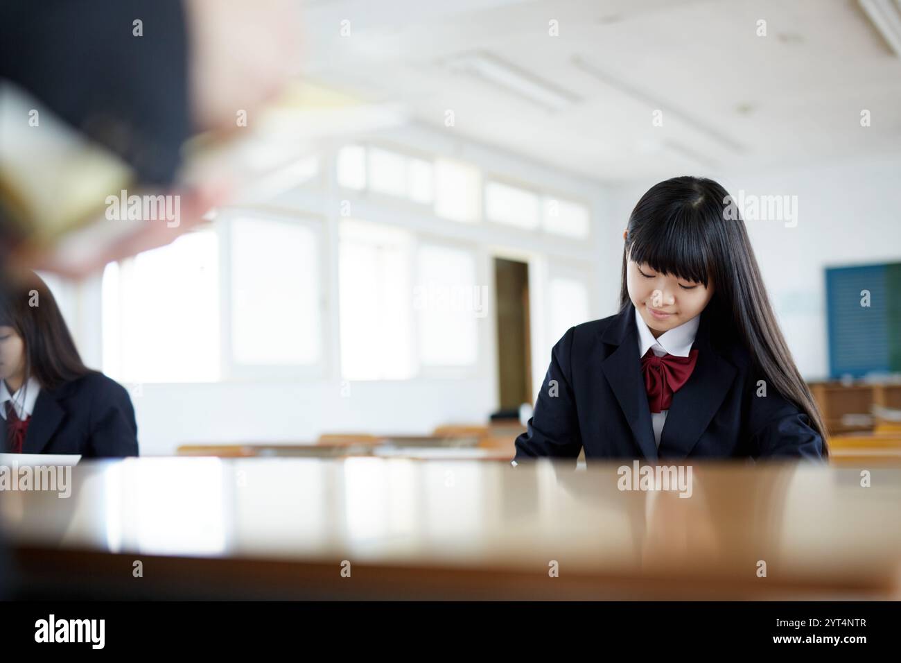 Female high school students in class Stock Photo - Alamy