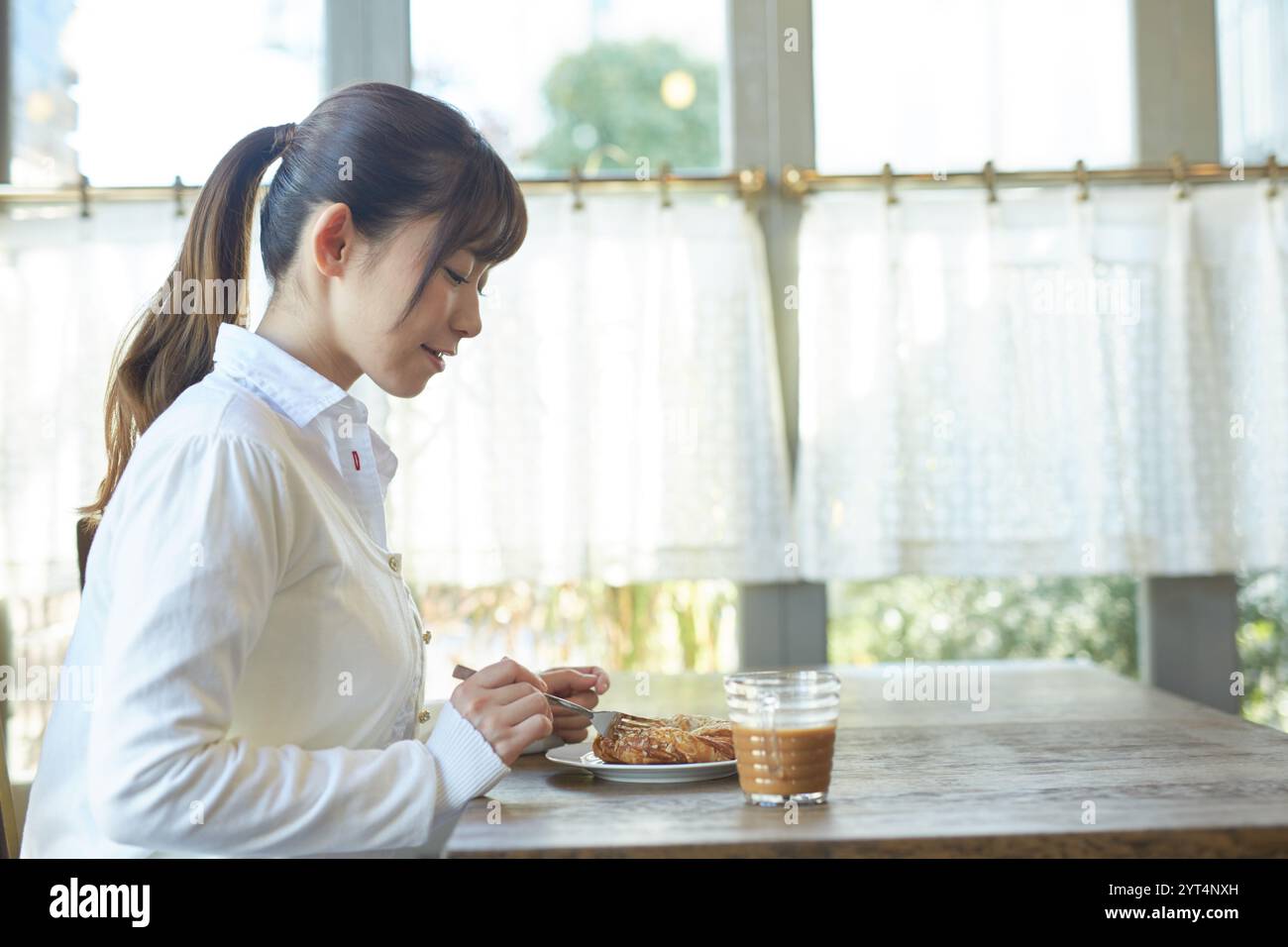 Woman eating sweets hi-res stock photography and images - Alamy