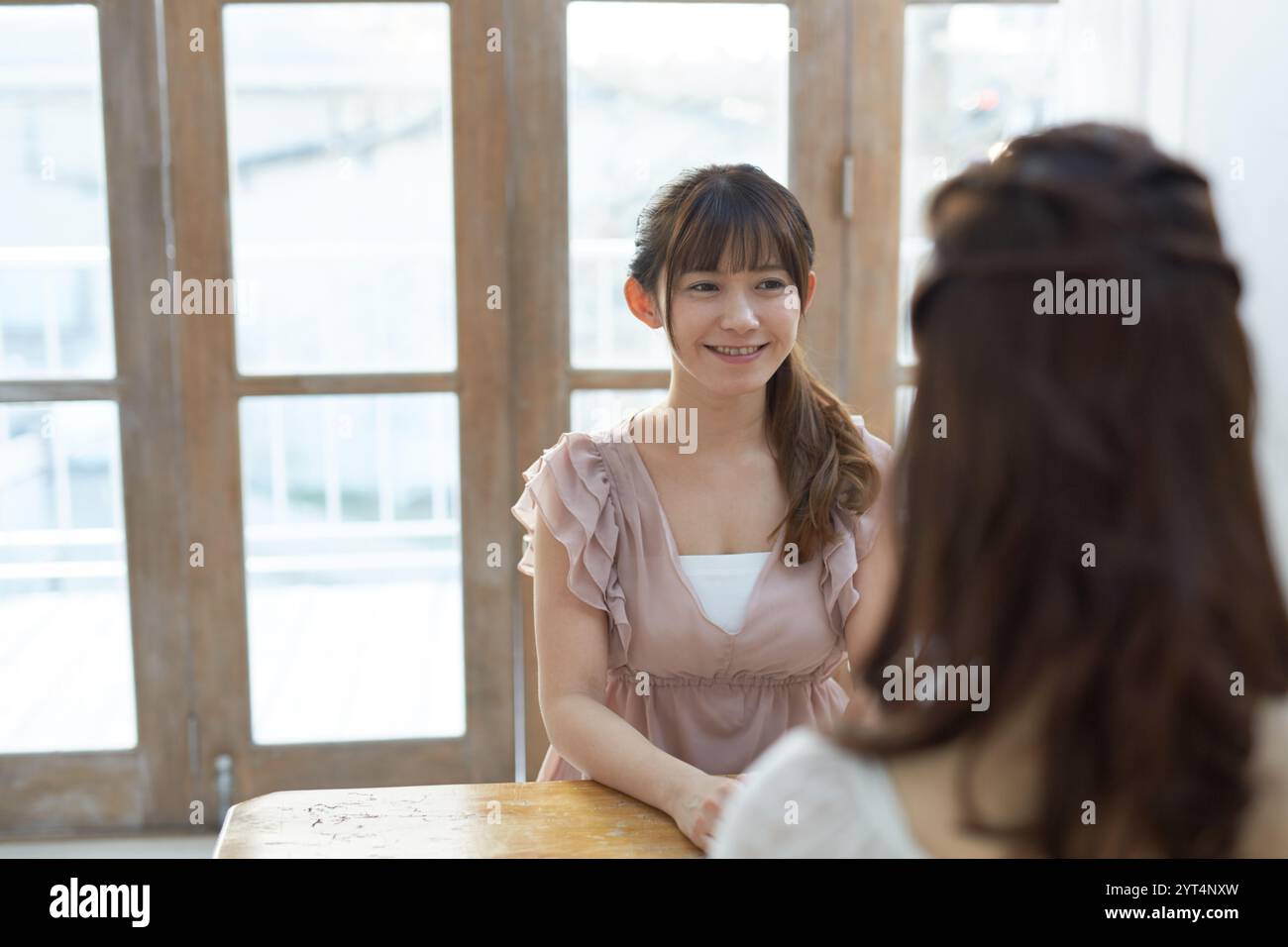 Two women in conversation Stock Photo - Alamy
