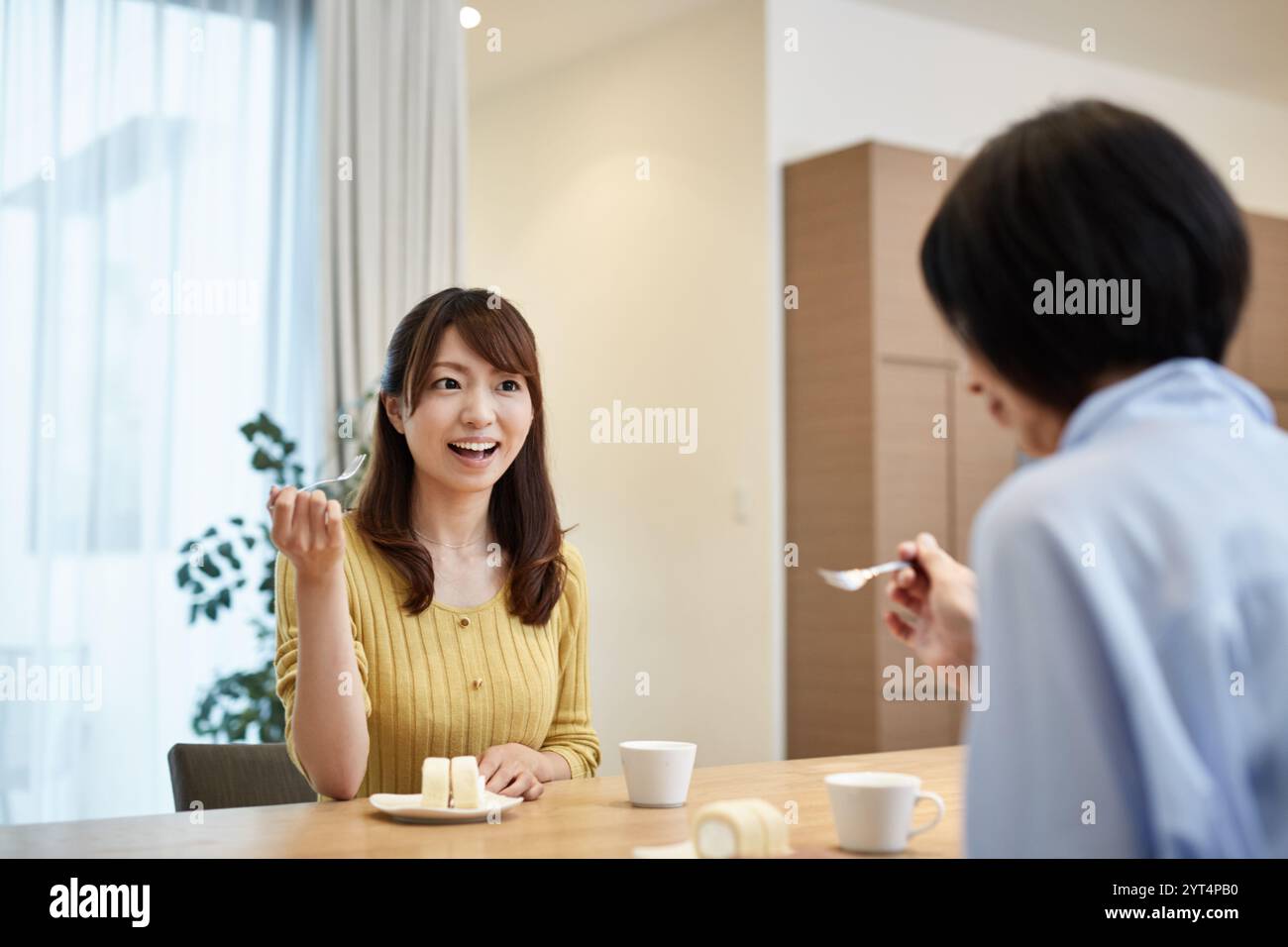 Parent and child eating sweets Stock Photo - Alamy