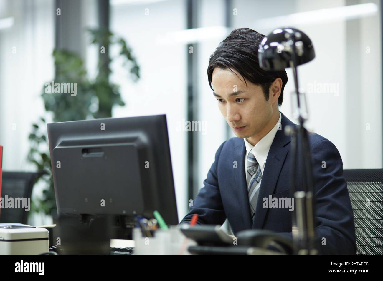 Young businessman sit desk hi-res stock photography and images - Alamy