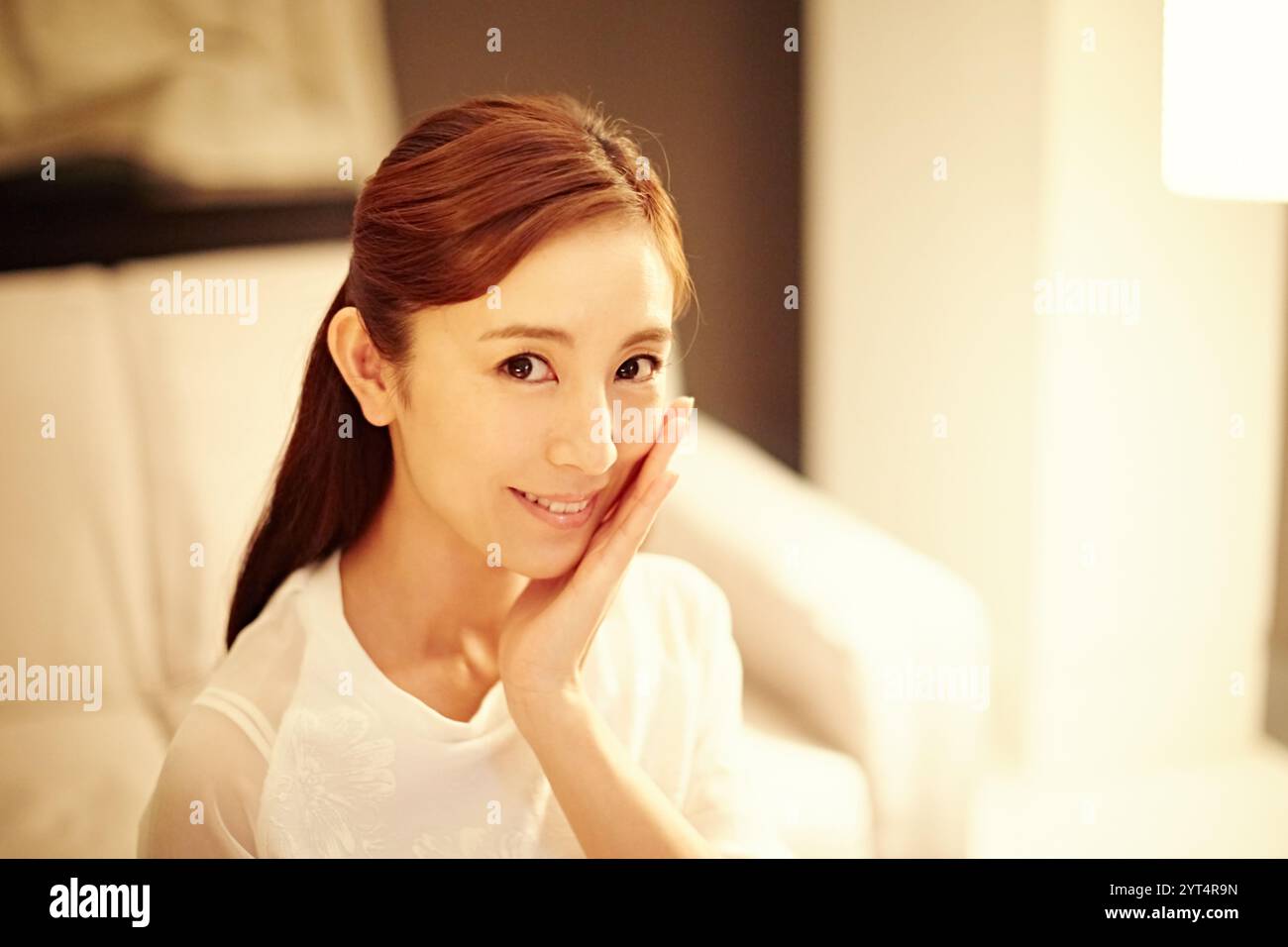 Woman taking care of skin at night Stock Photo - Alamy