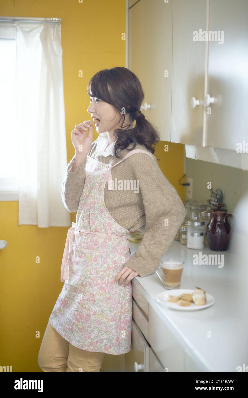 Eating biscuits woman hi-res stock photography and images - Alamy