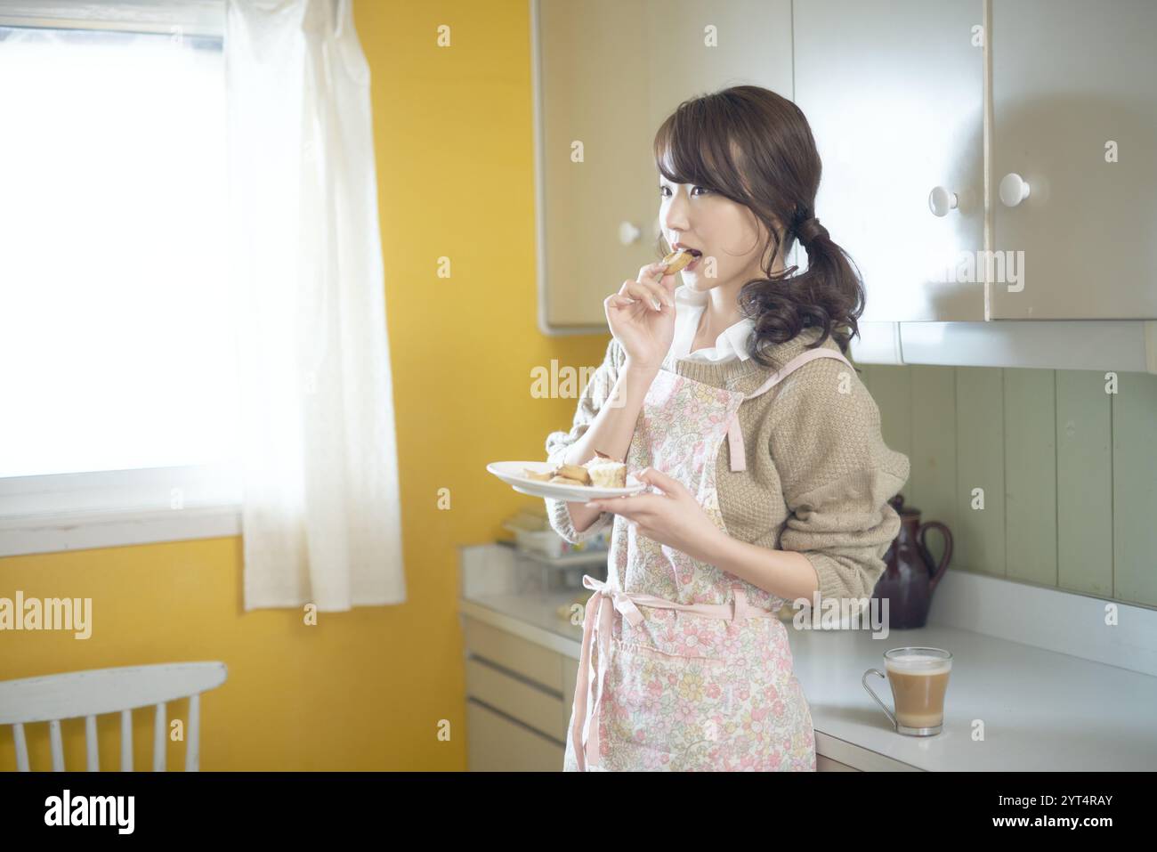 Eating biscuits woman hi-res stock photography and images - Alamy