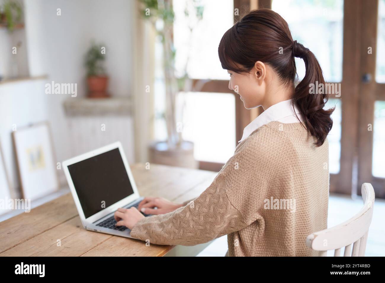 Women using computer in room Stock Photo - Alamy