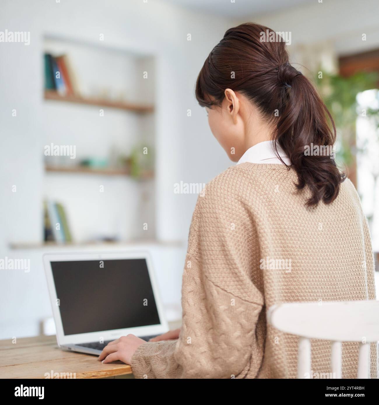 Women using computer in room Stock Photo - Alamy