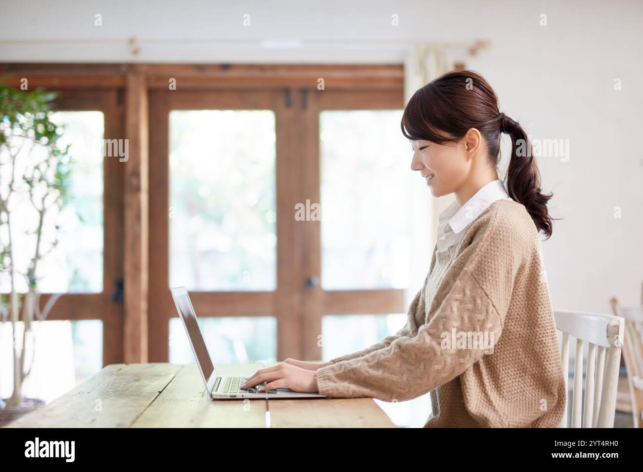 Women using computer in room Stock Photo - Alamy