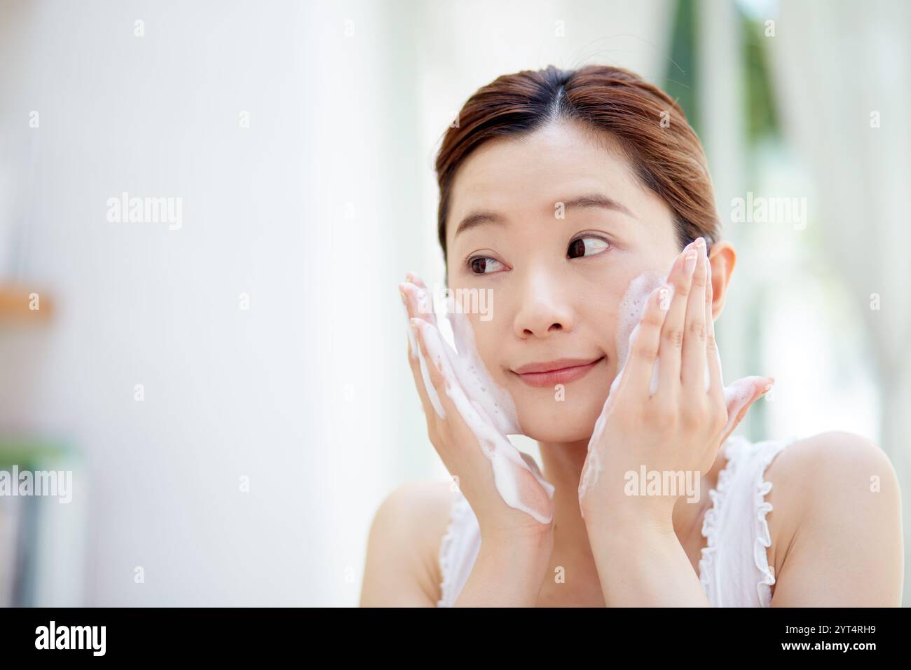 Woman washing face foam hi-res stock photography and images - Alamy