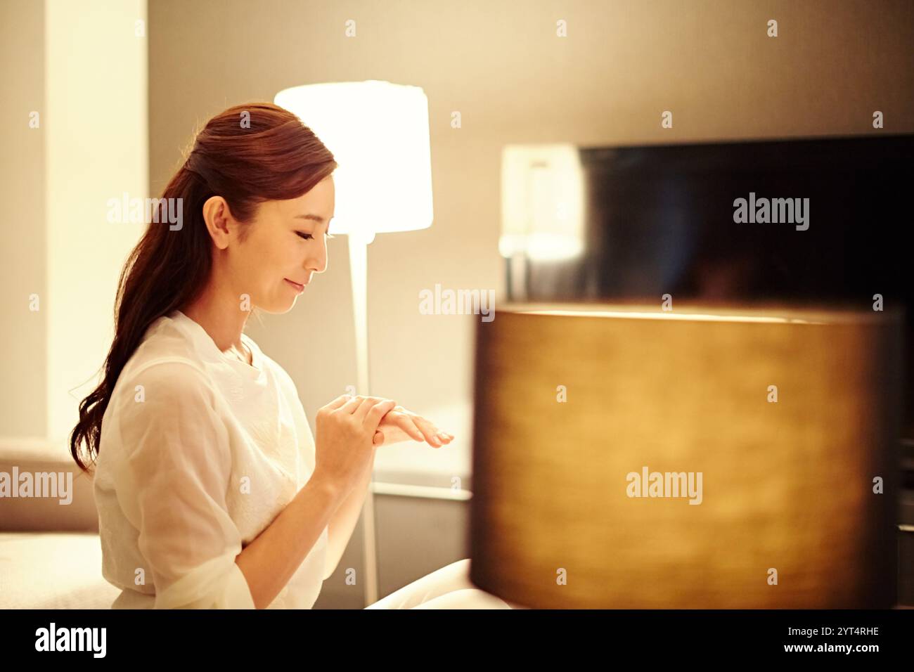Woman taking care of skin at night Stock Photo - Alamy