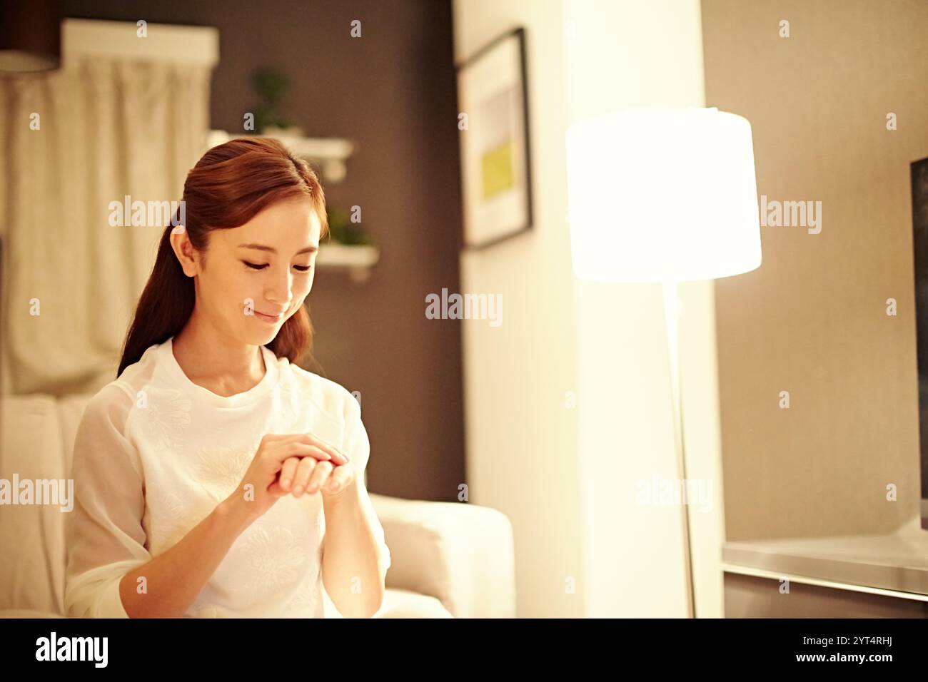 Woman taking care of skin at night Stock Photo - Alamy