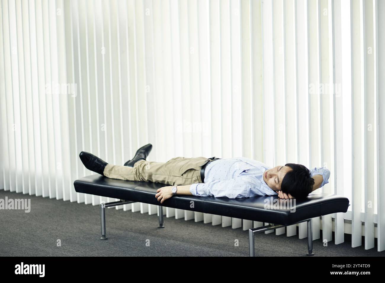Young man lying on work bench hi-res stock photography and images - Alamy