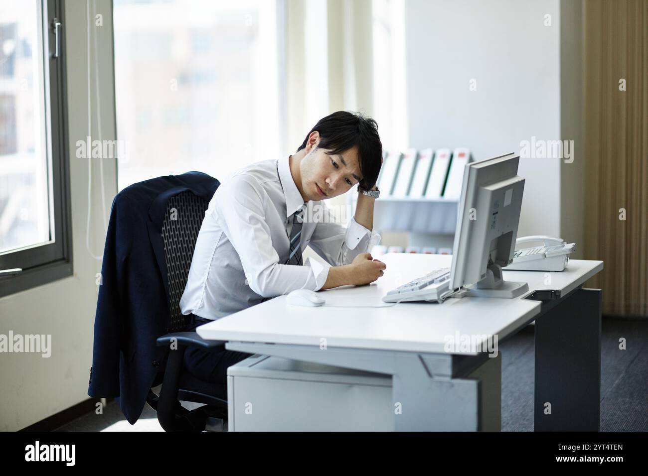 Businessman tired of work Stock Photo - Alamy
