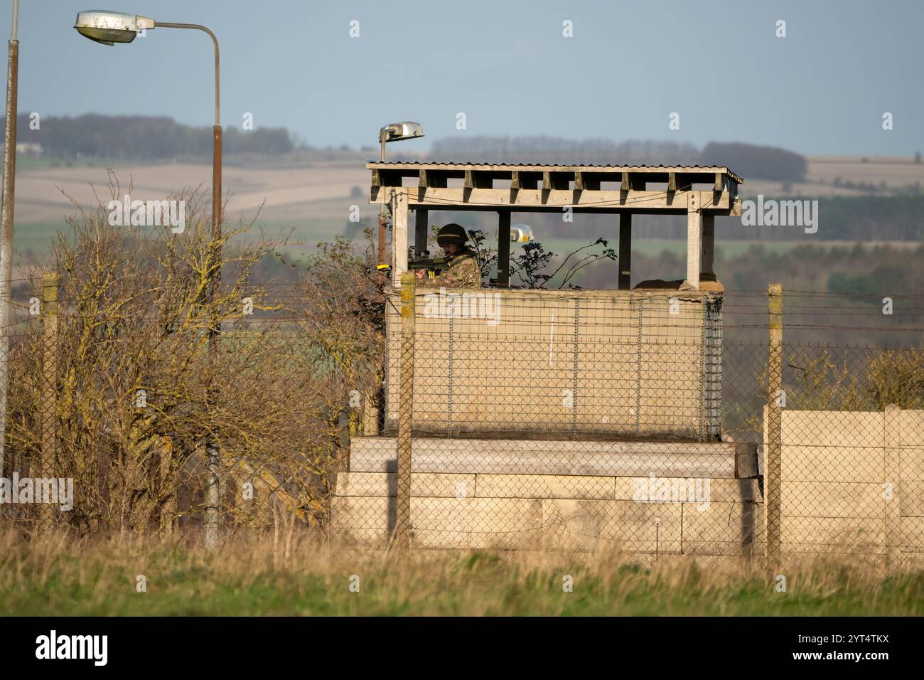 soldier with automatic rifle manning a lookout tower sentry post Stock ...