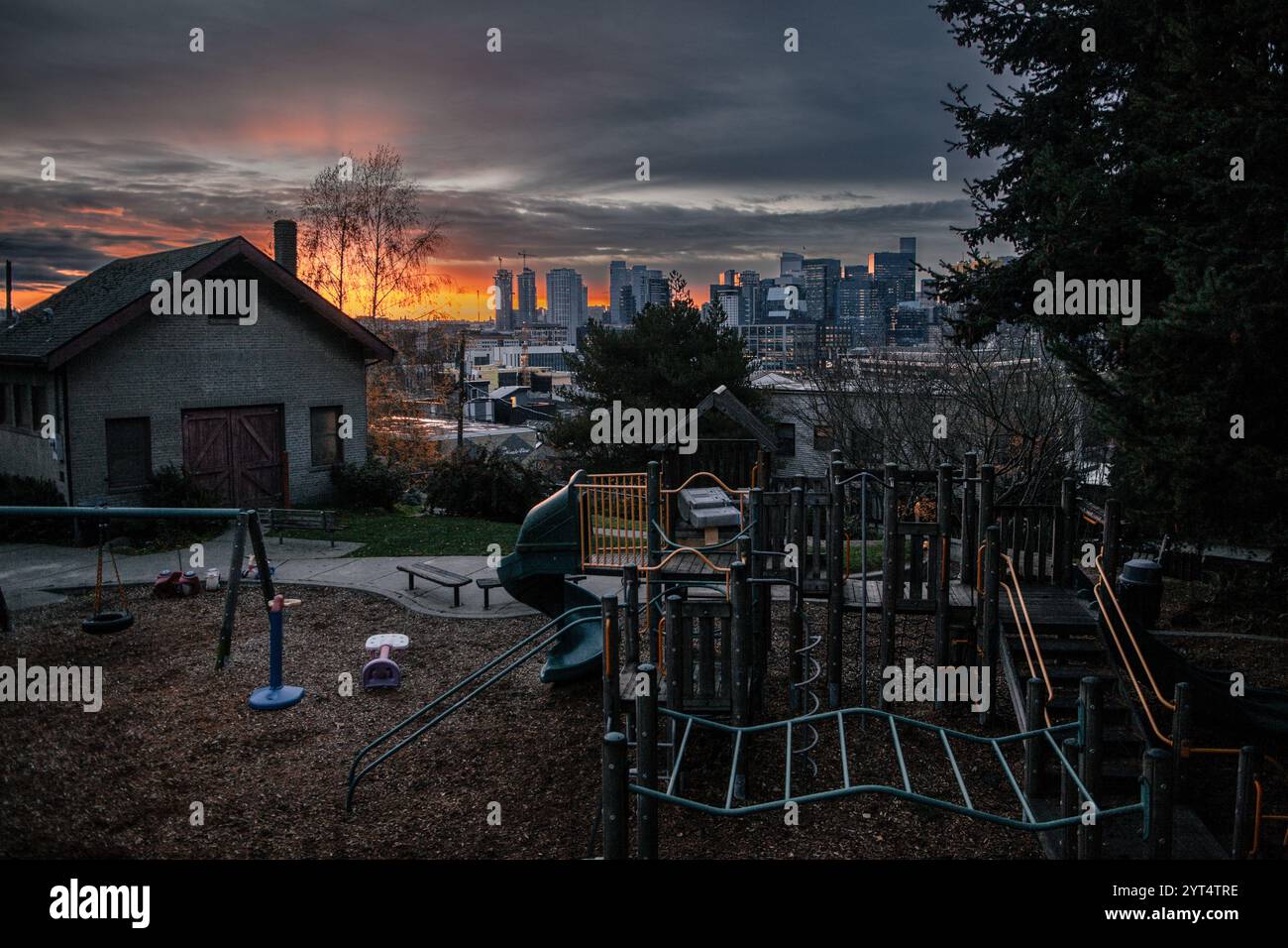 Children's playground and city skyline at sunrise after a storm Stock ...