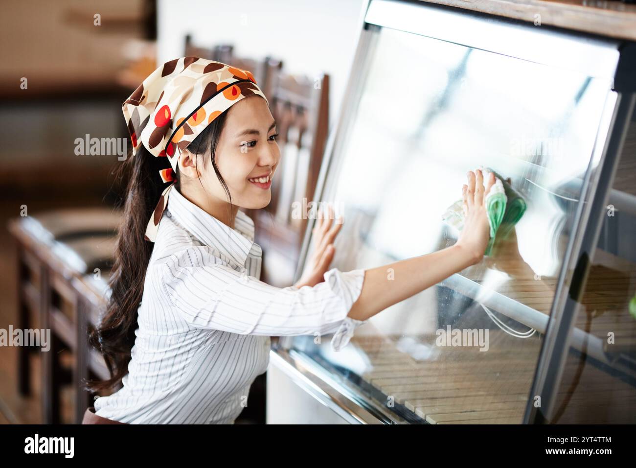 Women cleaning at a café Stock Photo - Alamy