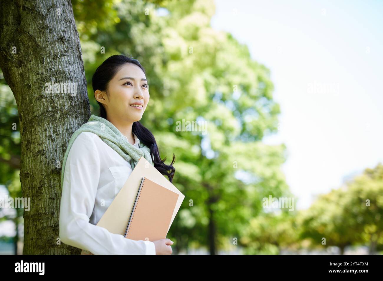 Fresh green and female student Stock Photo - Alamy