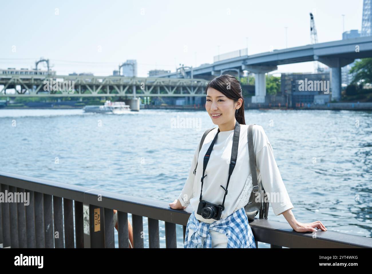 Refreshing woman on the riverside Stock Photo - Alamy