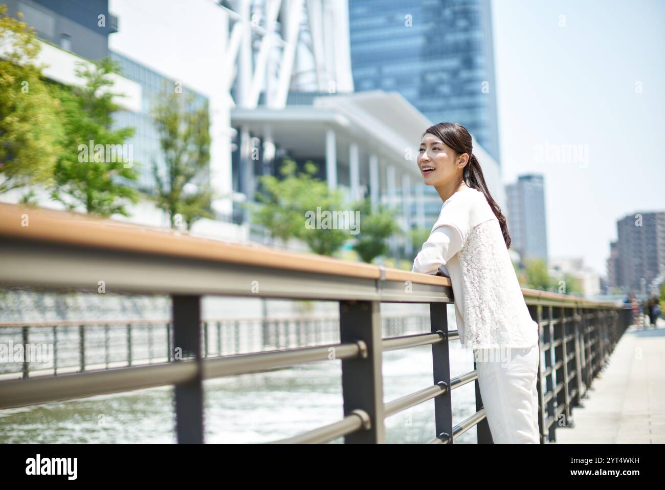 Refreshing woman on the riverside Stock Photo - Alamy