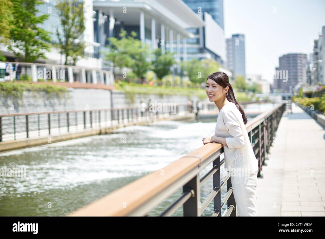 Refreshing woman on the riverside Stock Photo - Alamy