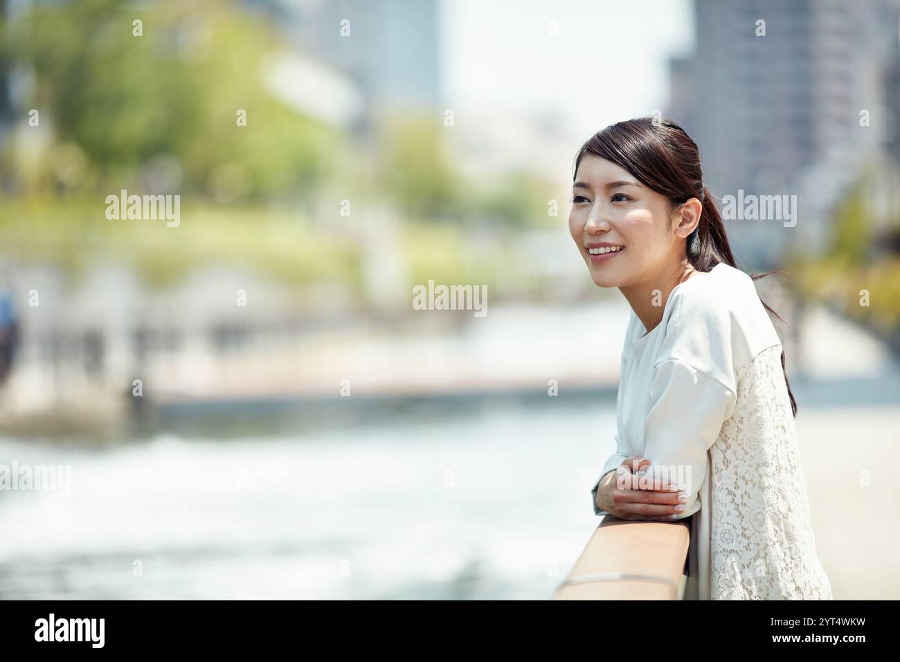 Refreshing woman on the riverside Stock Photo - Alamy