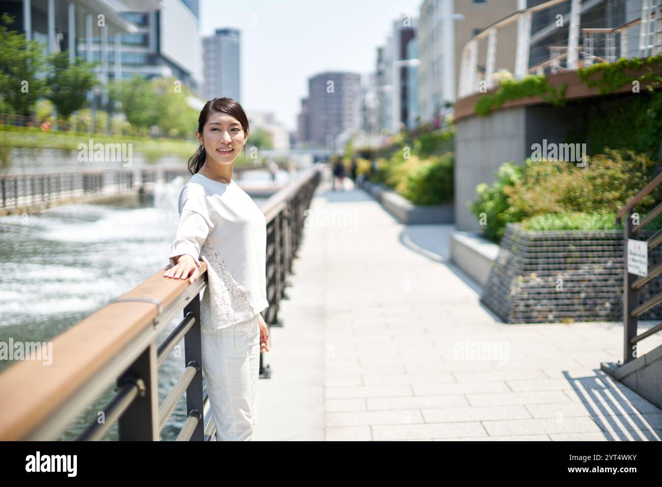 Refreshing woman on the riverside Stock Photo - Alamy