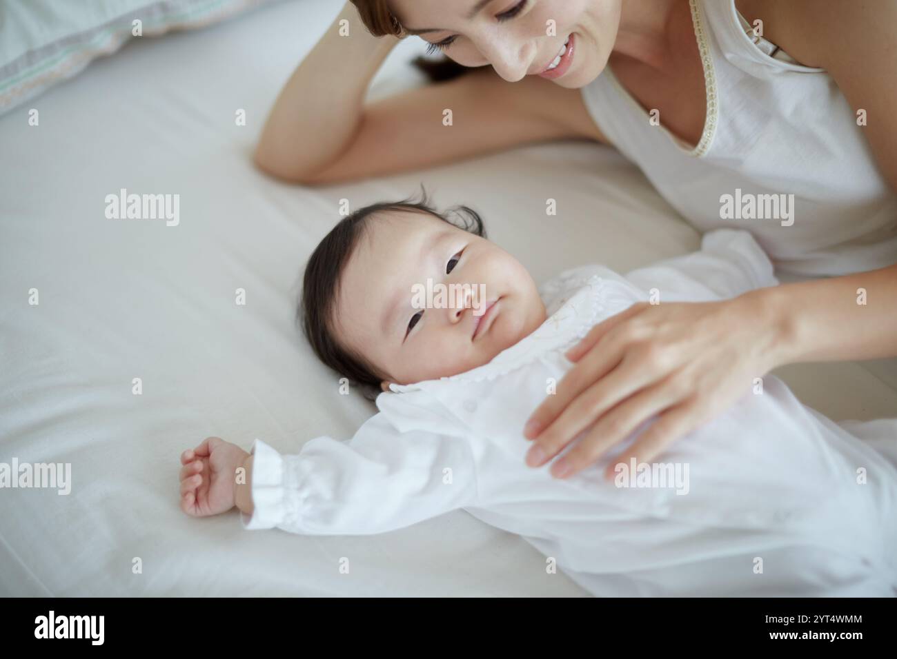 Mother putting baby to sleep Stock Photo - Alamy