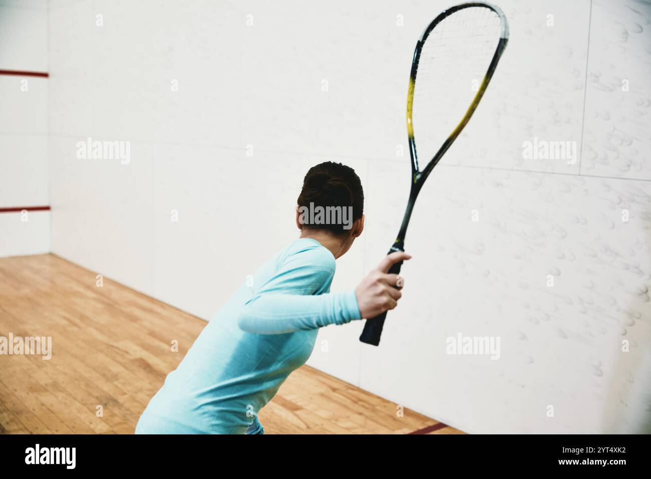 Woman enjoying a game of squash Stock Photo - Alamy