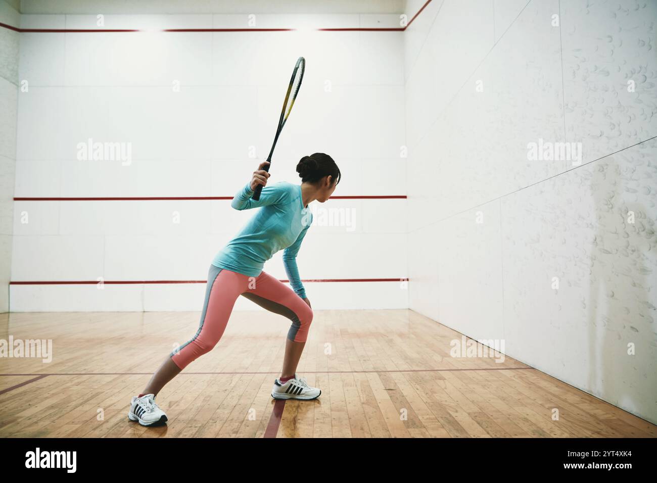 Woman enjoying a game of squash Stock Photo - Alamy