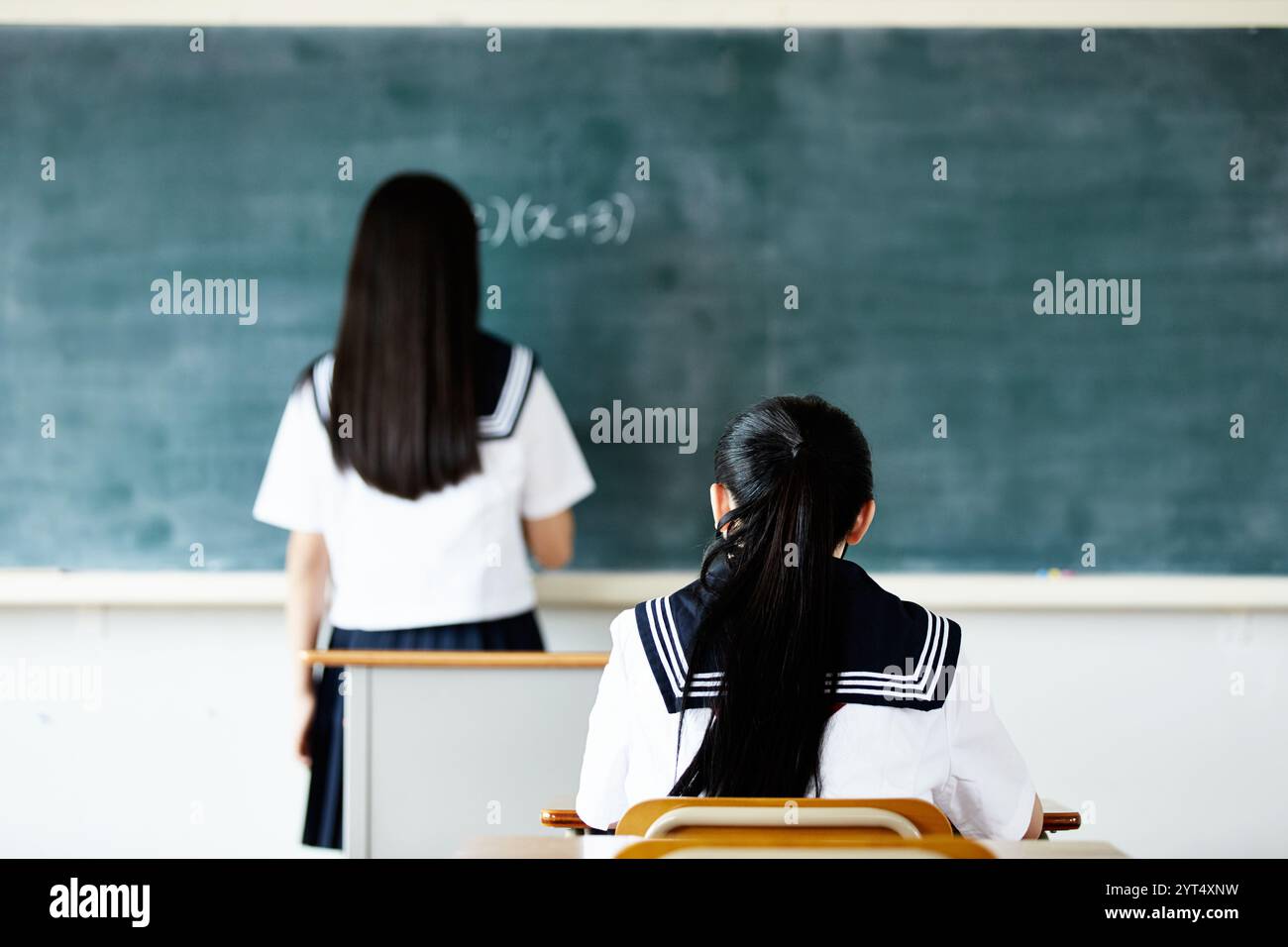 High school girls studying in a classroom Stock Photo - Alamy