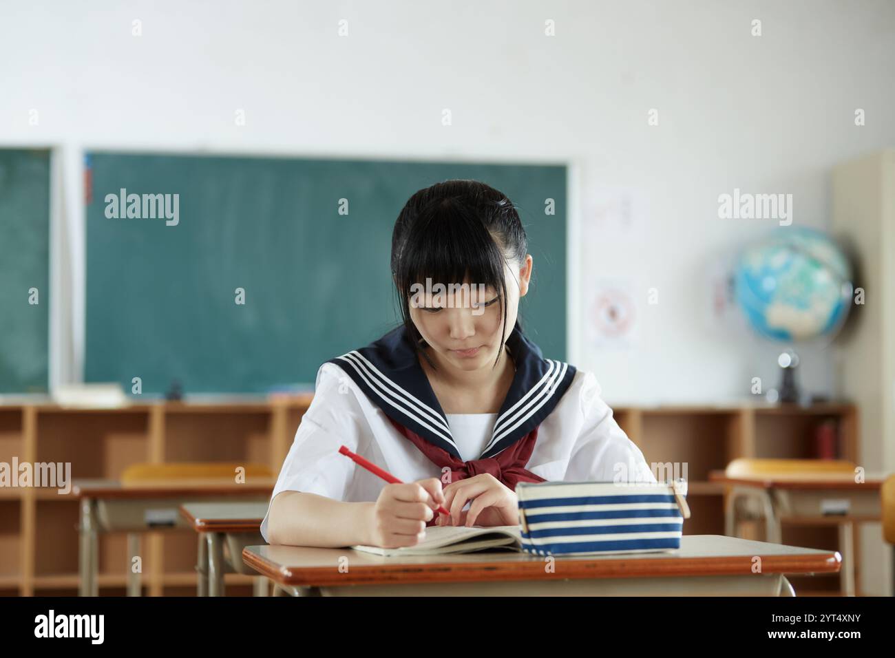 High school girls studying in a classroom Stock Photo - Alamy