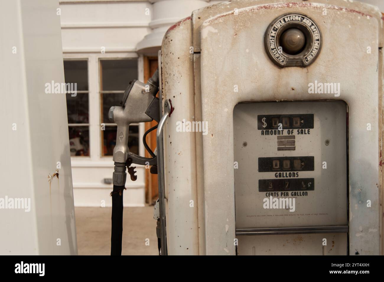 Rustic vintage gas pump with nozzle and faded display Stock Photo - Alamy