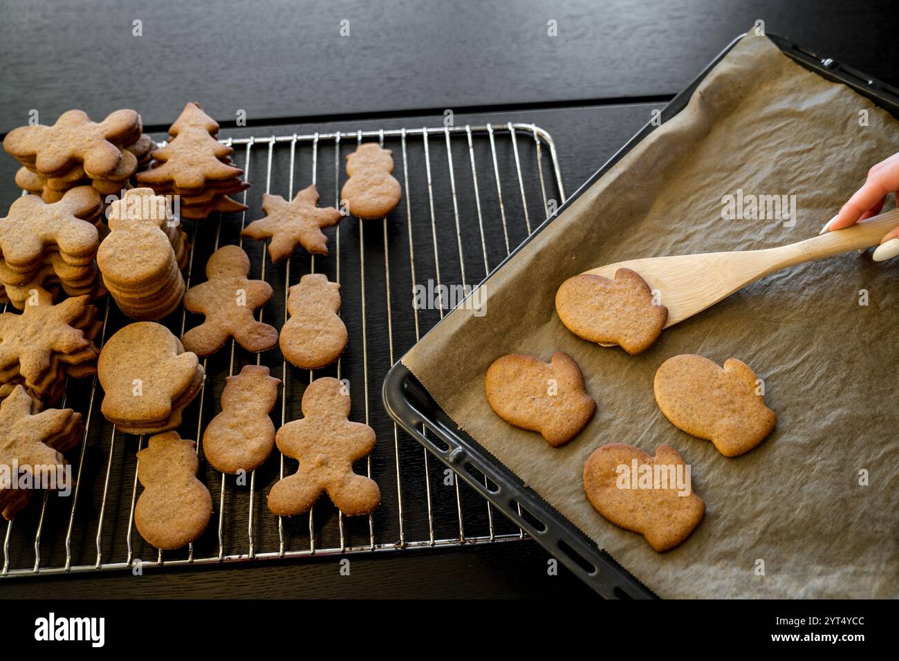 Baking Gingerbread Christmas Cookies in different shapes Stock Photo ...